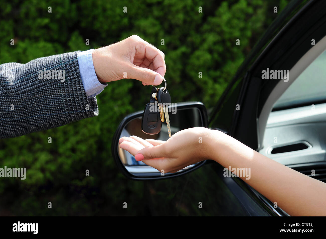 Woman handing over the car keys hi-res stock photography and images - Alamy