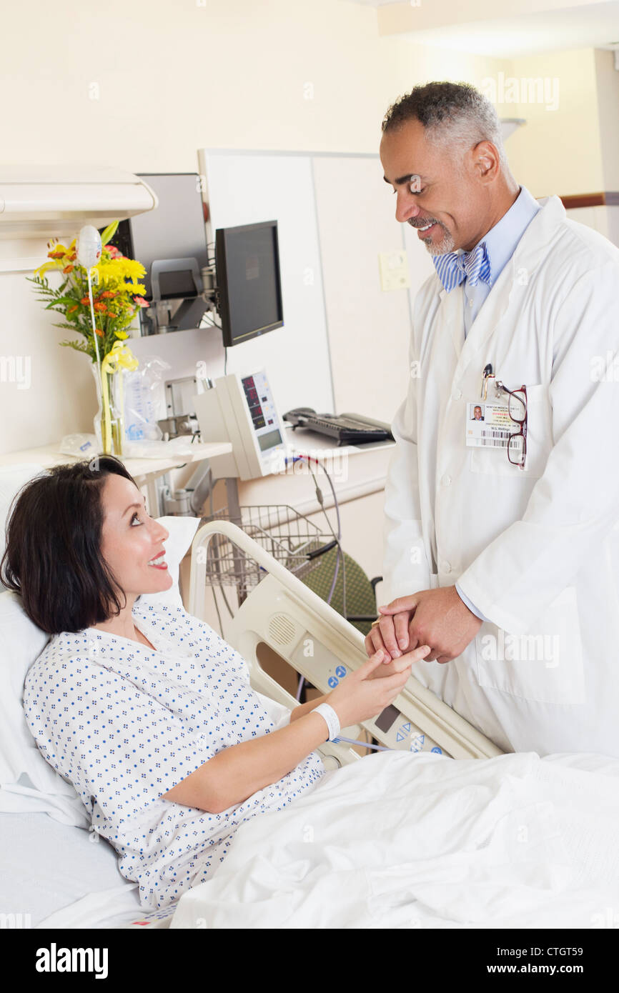 Doctor comforting patient in hospital Stock Photo - Alamy