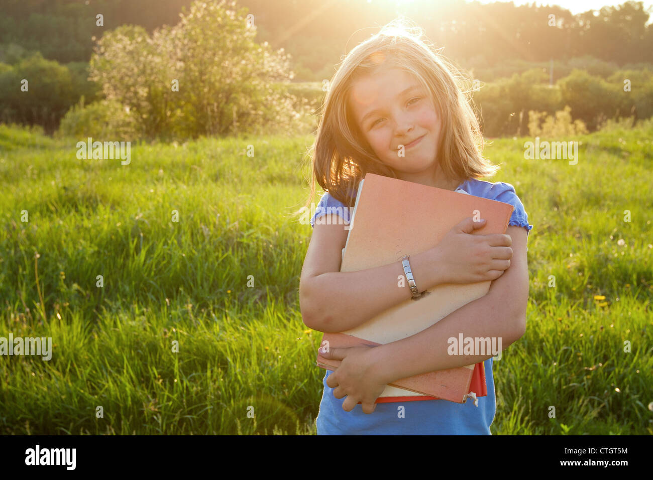 girl with book Stock Photo - Alamy