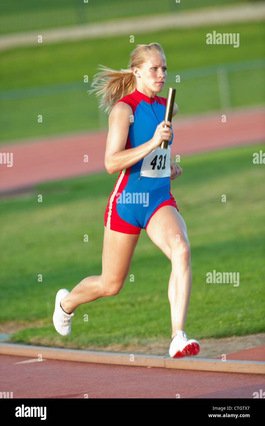 Women track baton relay hi-res stock photography and images - Alamy