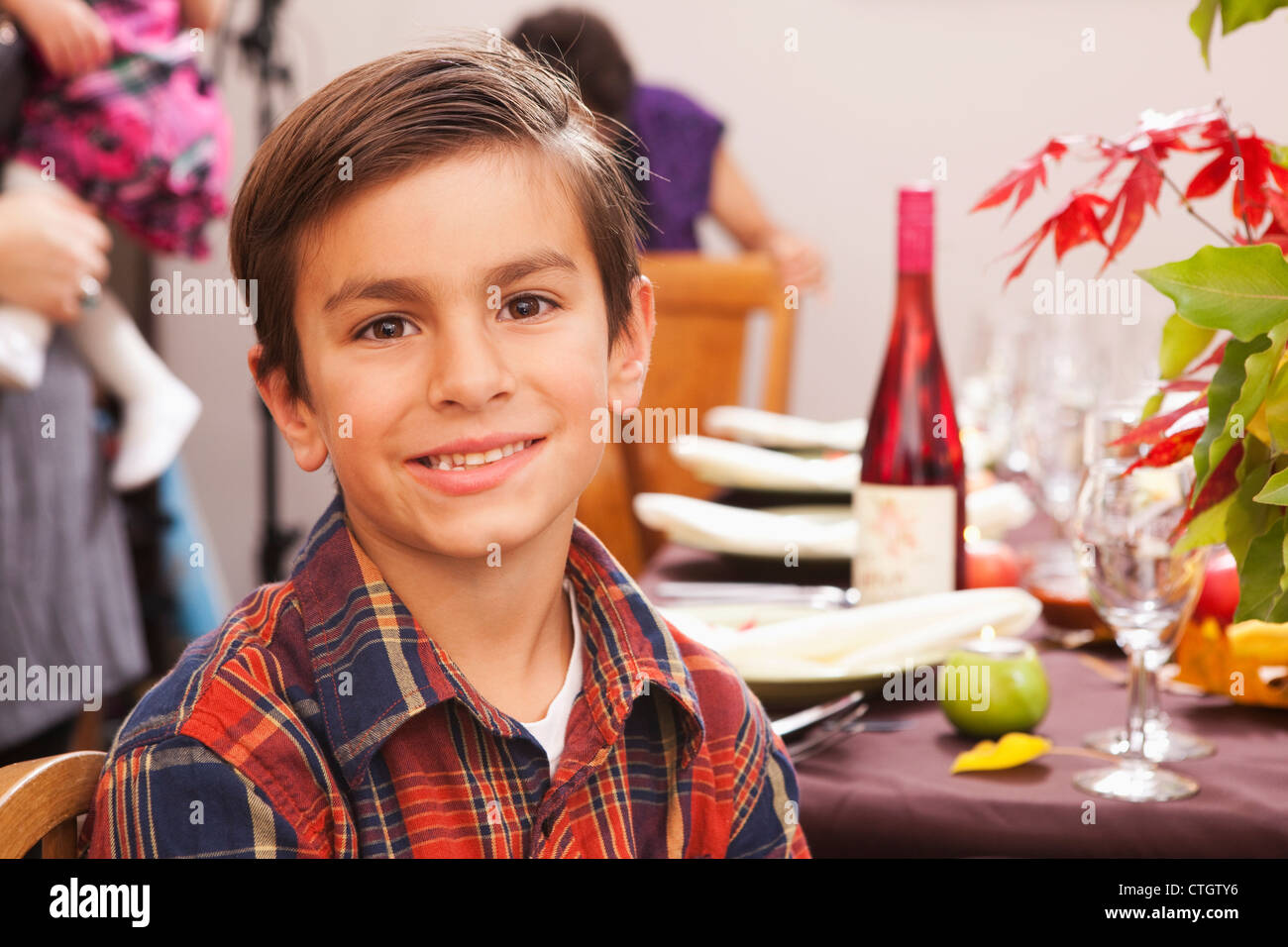 Smiling Hispanic boy at Thanksgiving dinner Stock Photo - Alamy