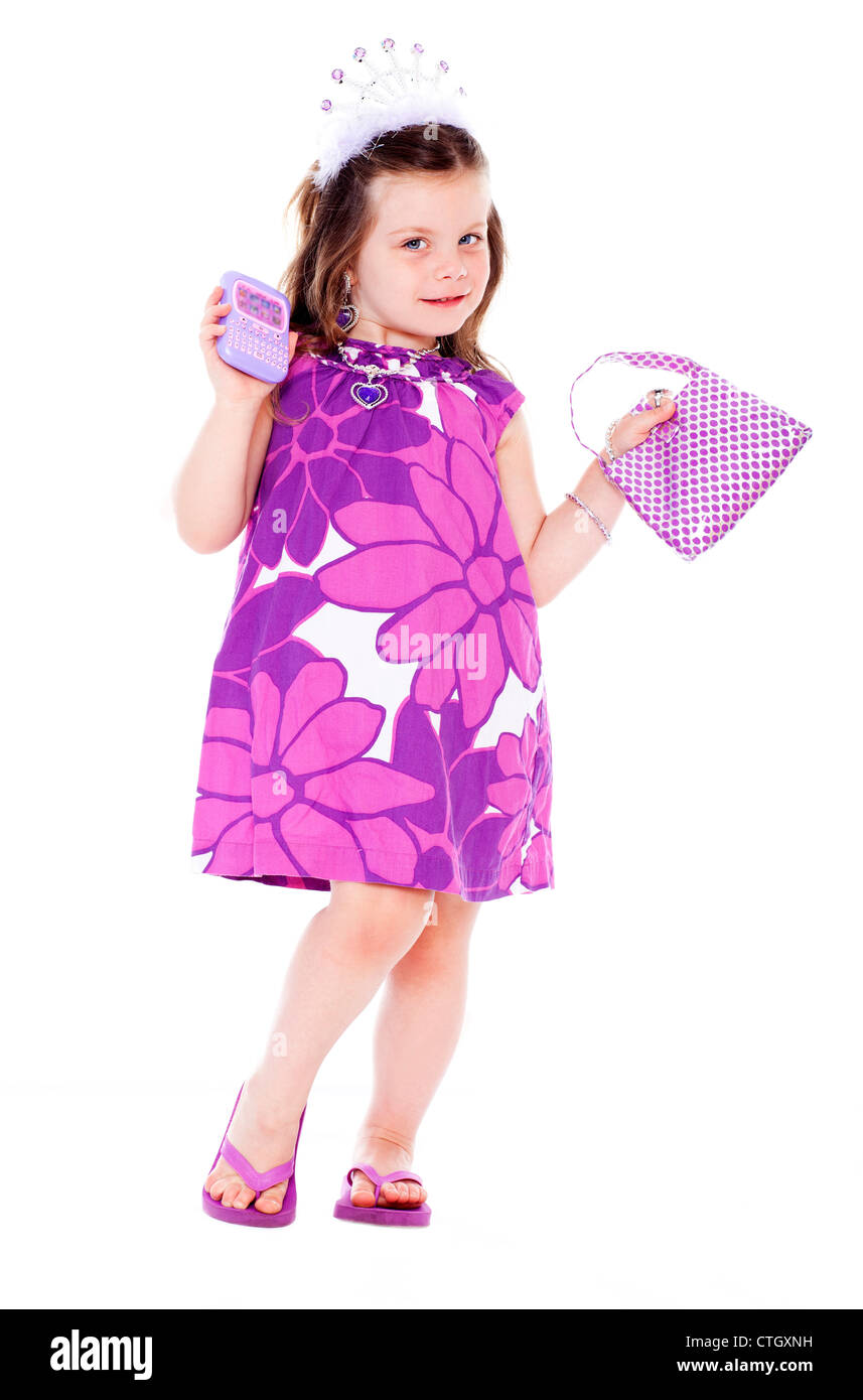 Pretty little girl playing dress up isolated on white Stock Photo - Alamy