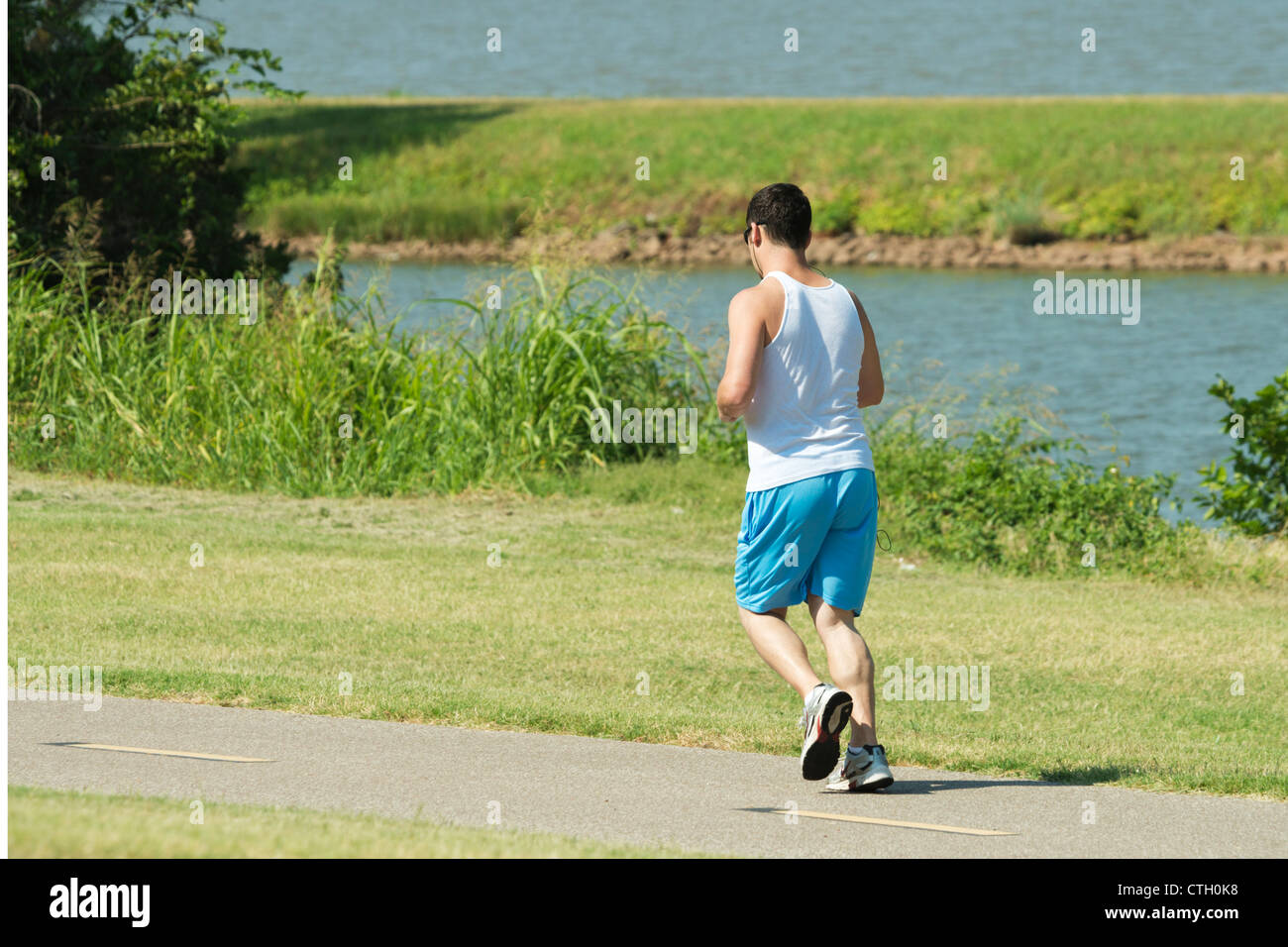 Man running in nature near a lake hi-res stock photography and images ...
