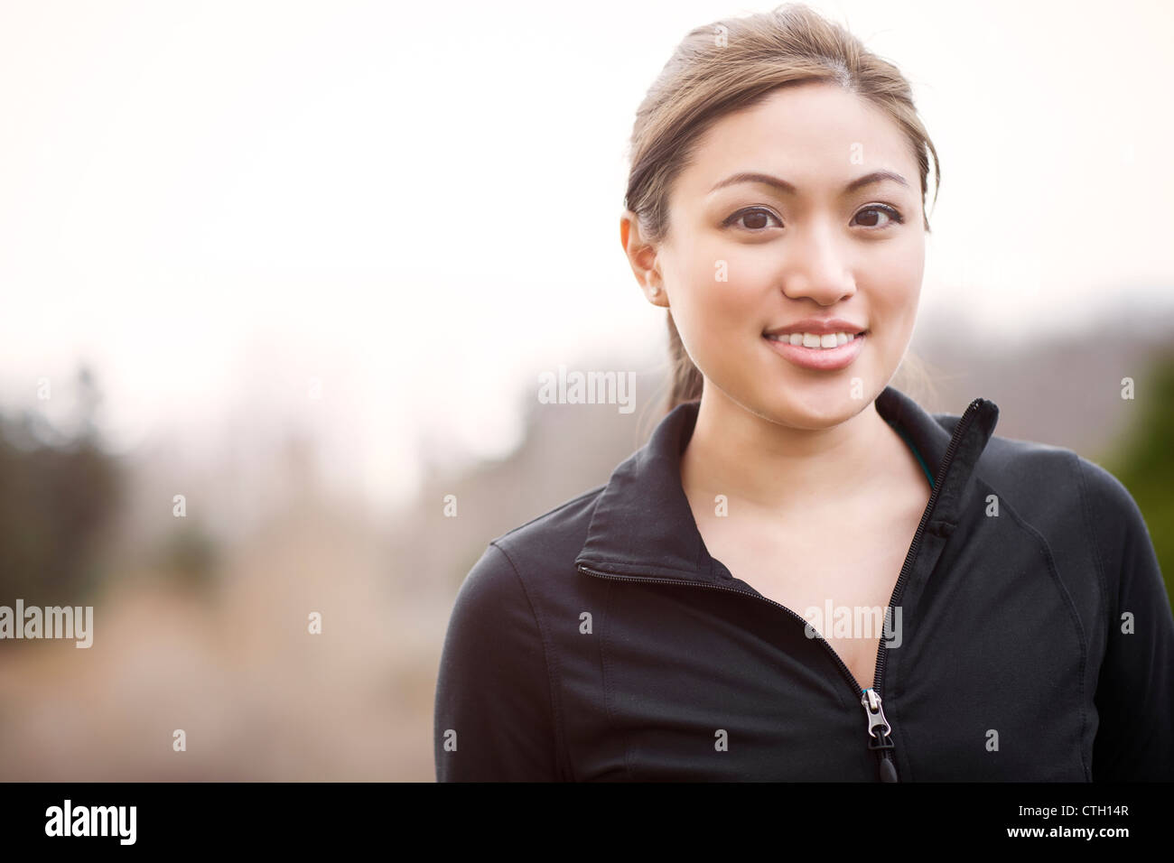 Smiling Asian woman Stock Photo - Alamy