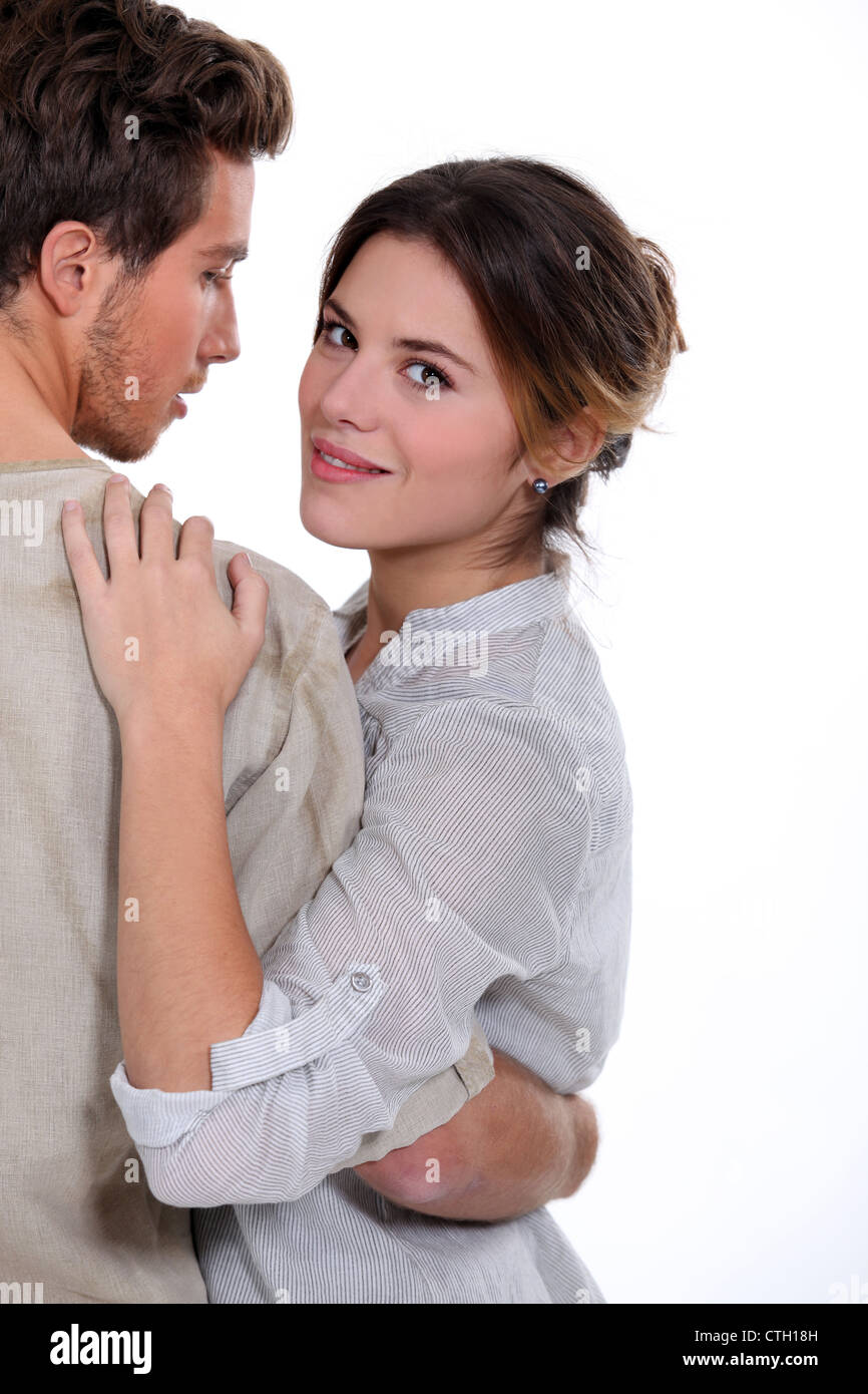 Young couple holding each other Stock Photo - Alamy