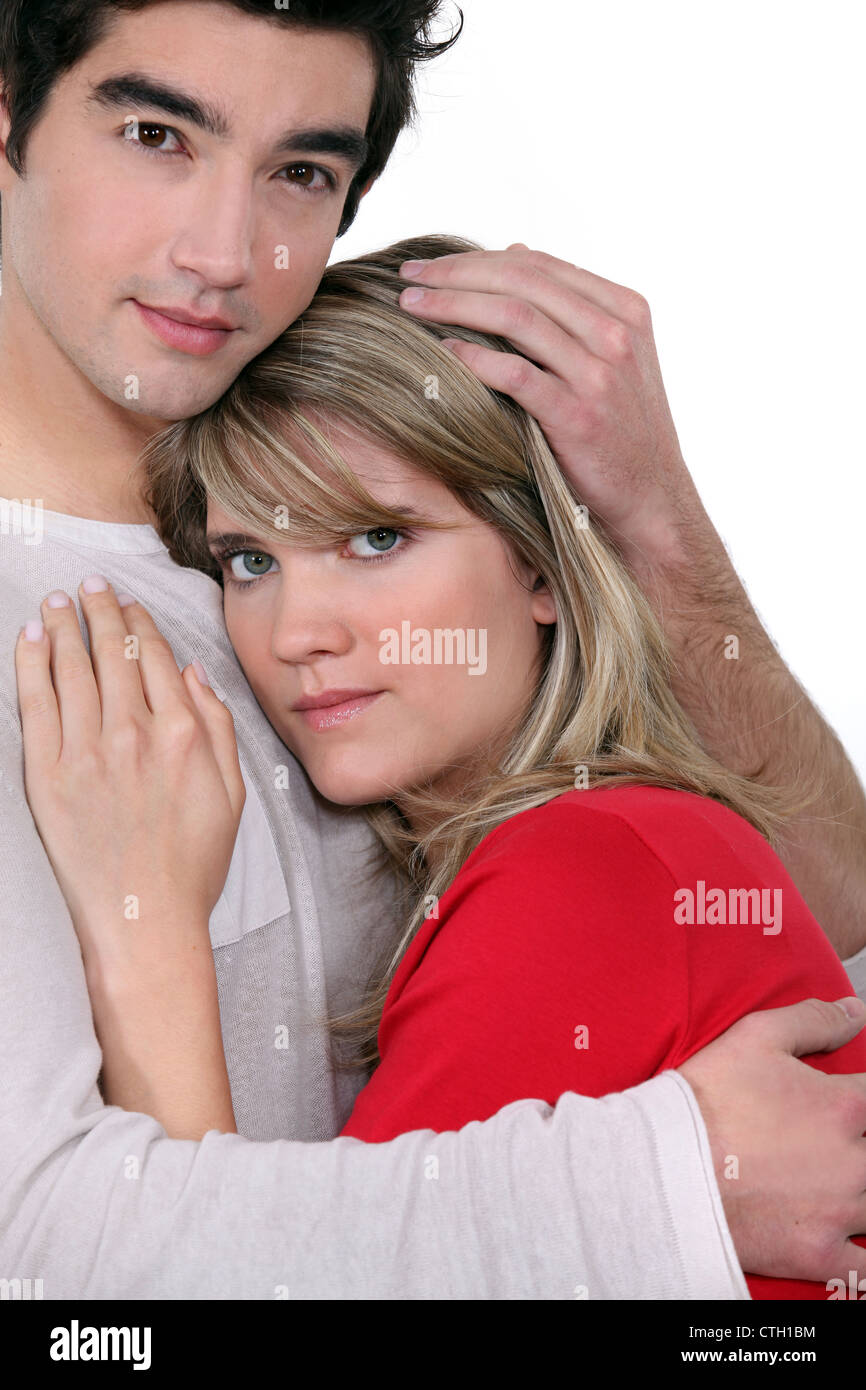 Boyfriend hugging his girlfriend Stock Photo - Alamy