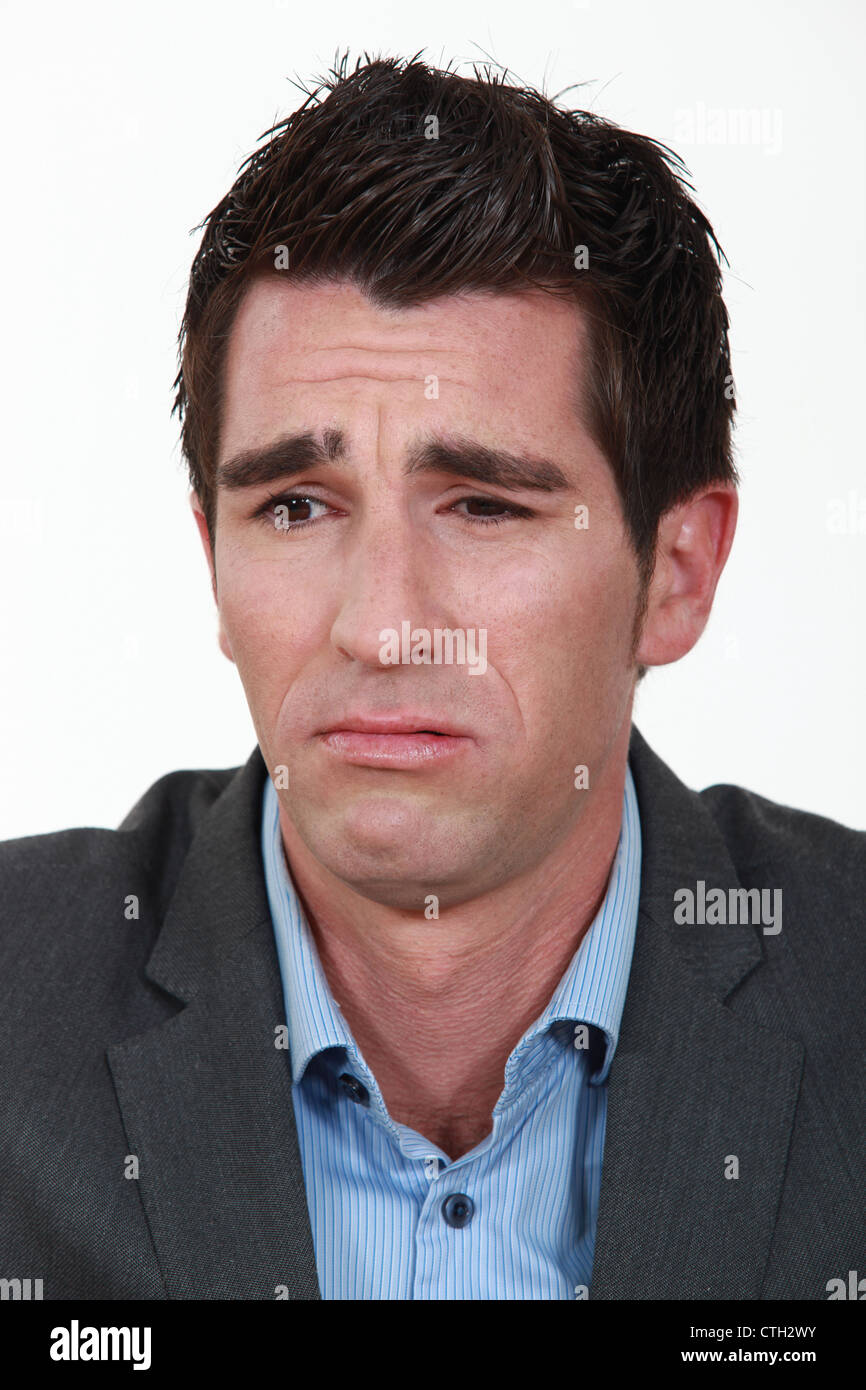 A businessman frowning Stock Photo - Alamy