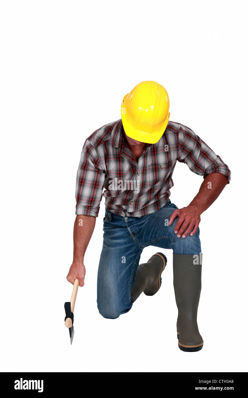 Tradesman using an axe Stock Photo - Alamy