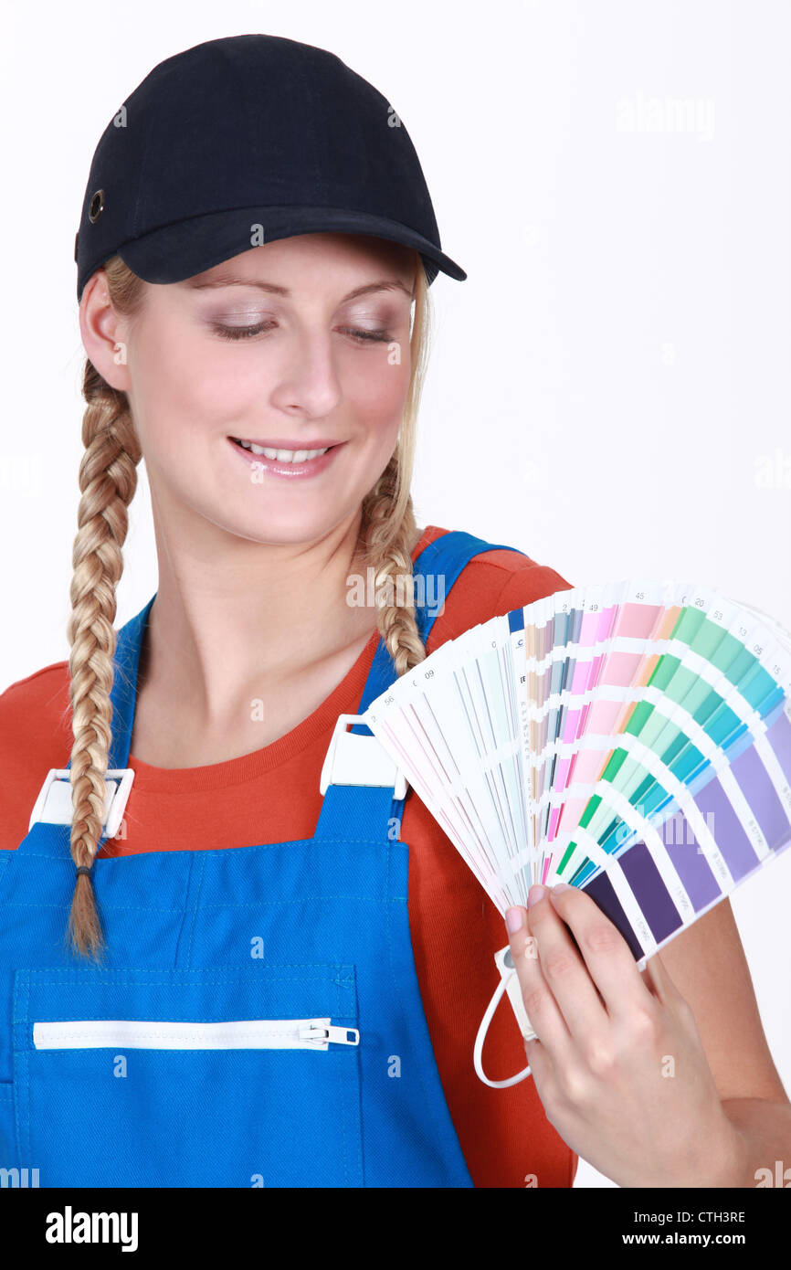 Woman choosing which color paint to use Stock Photo - Alamy