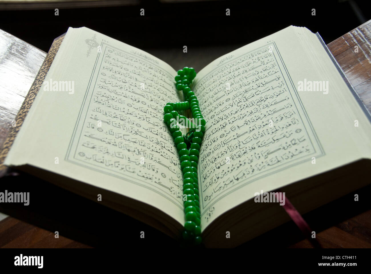 View of a Tasbih or Muslim Praying beads on top of the holy book Koran ...