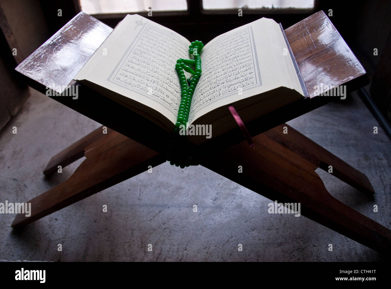 View of a Tasbih or Muslim Praying beads on top of the holy book Koran ...