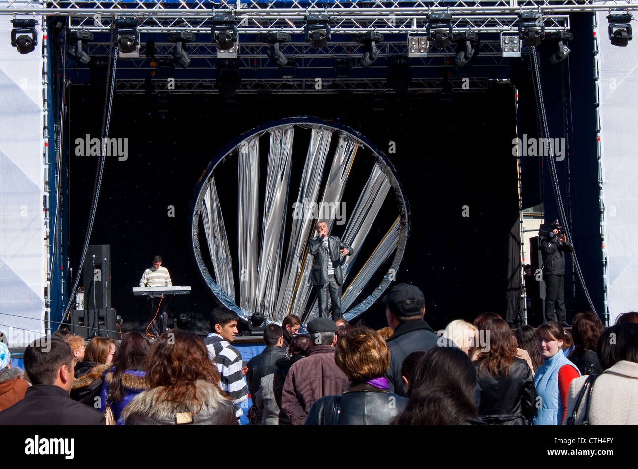 Large stage with singer and audience in front of the stage Stock Photo ...