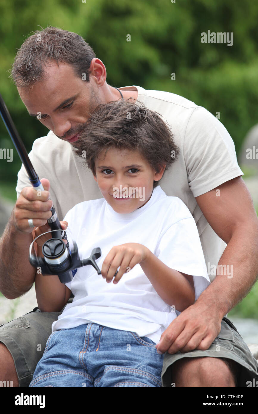 Father and son fishing together Stock Photo - Alamy