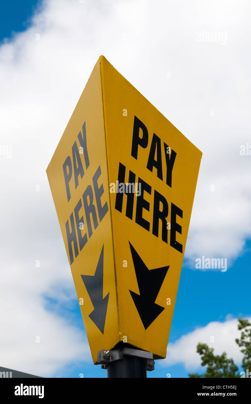 Pay here car park sign Stock Photo - Alamy