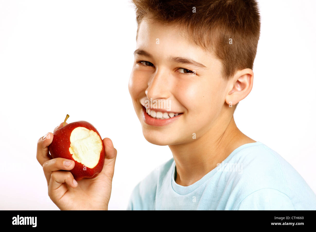 boy eat apple on white Stock Photo - Alamy