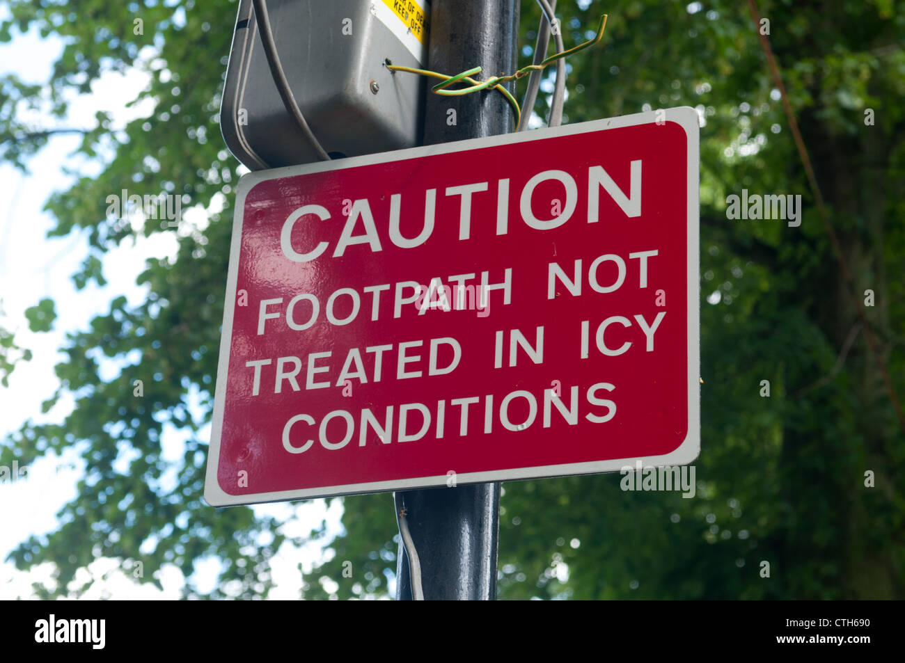 Caution footpath not treated in icy conditions sign Stock Photo - Alamy
