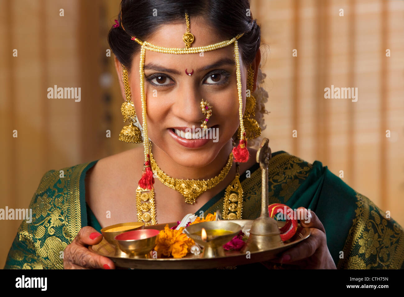 Portrait of beautiful young bride giving offerings Stock Photo - Alamy