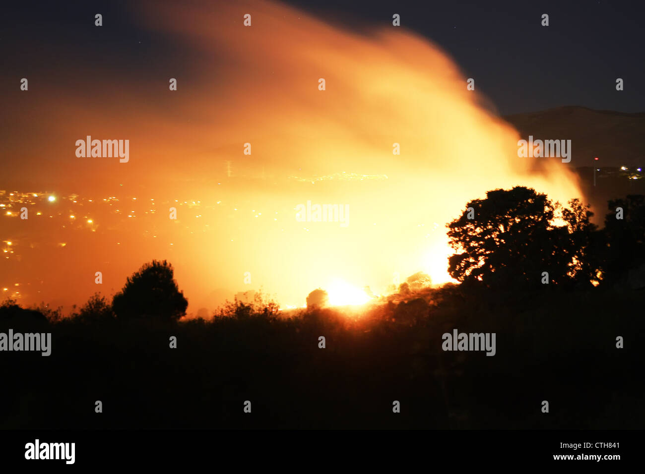 Fire on the mountain overnight Stock Photo - Alamy