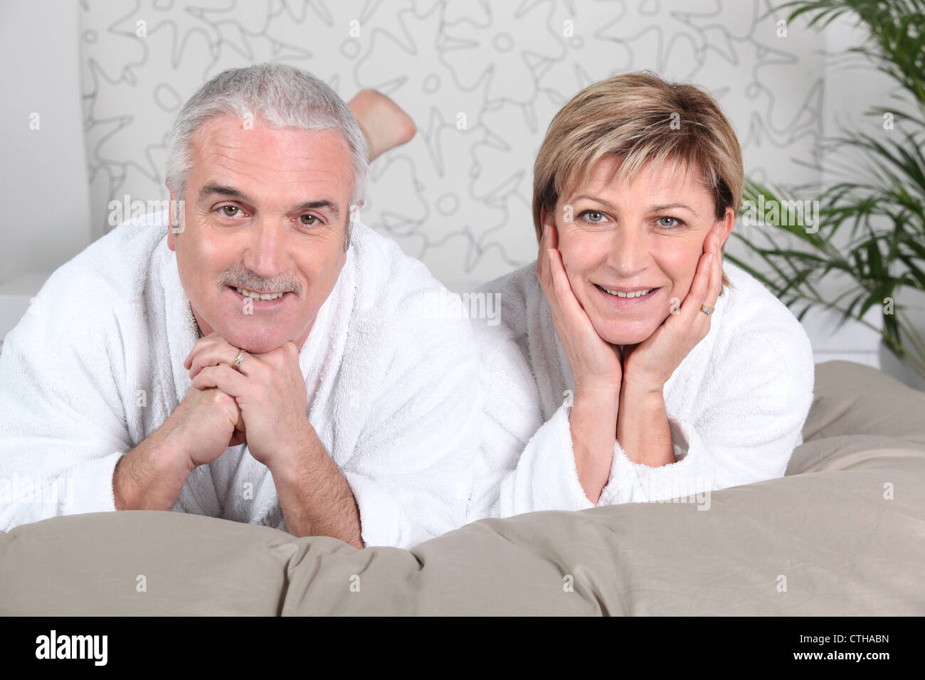 Mature couple in bed Stock Photo - Alamy