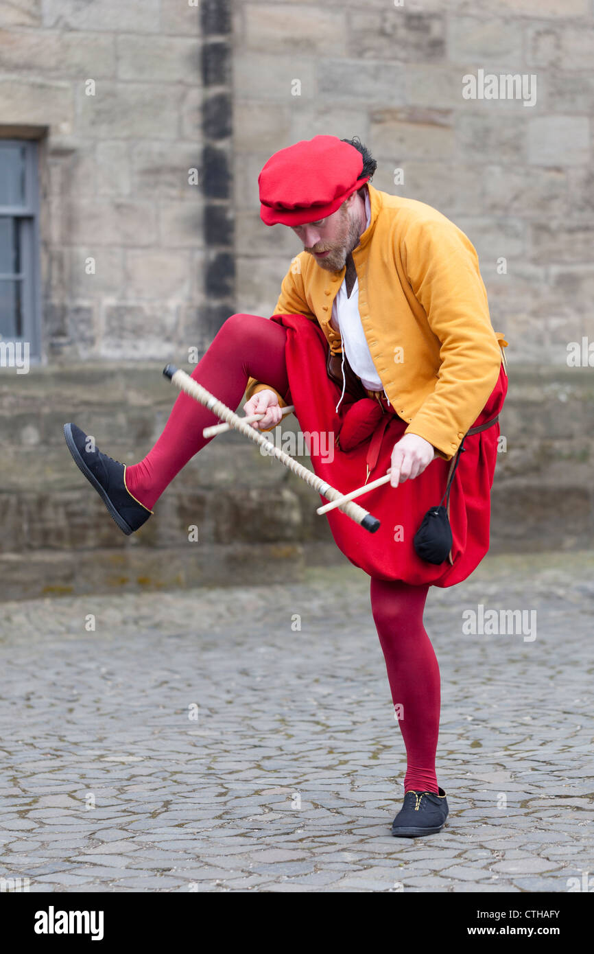 Juggler in historic costume entertains crowd Stock Photo - Alamy