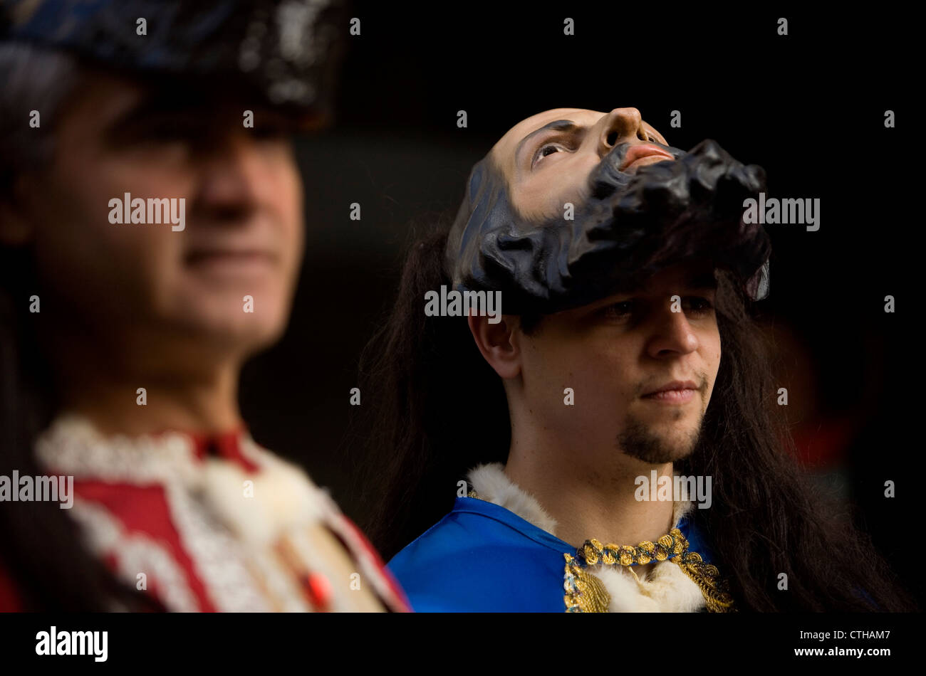 Men representing biblical characters wear masks on the top of their ...