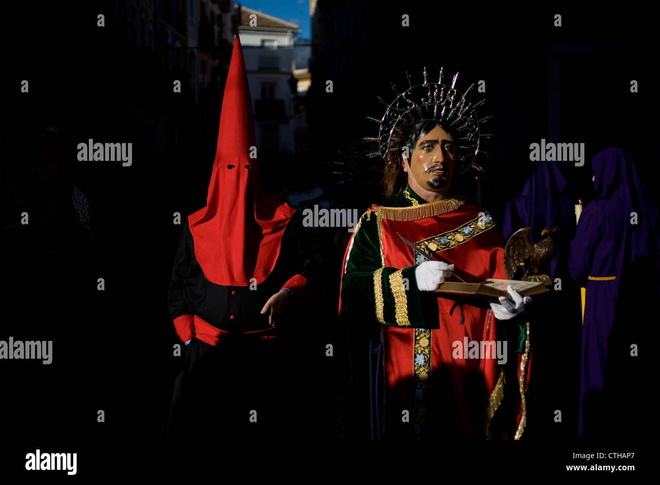 A masked man dressed as the biblical character Saint John during an ...
