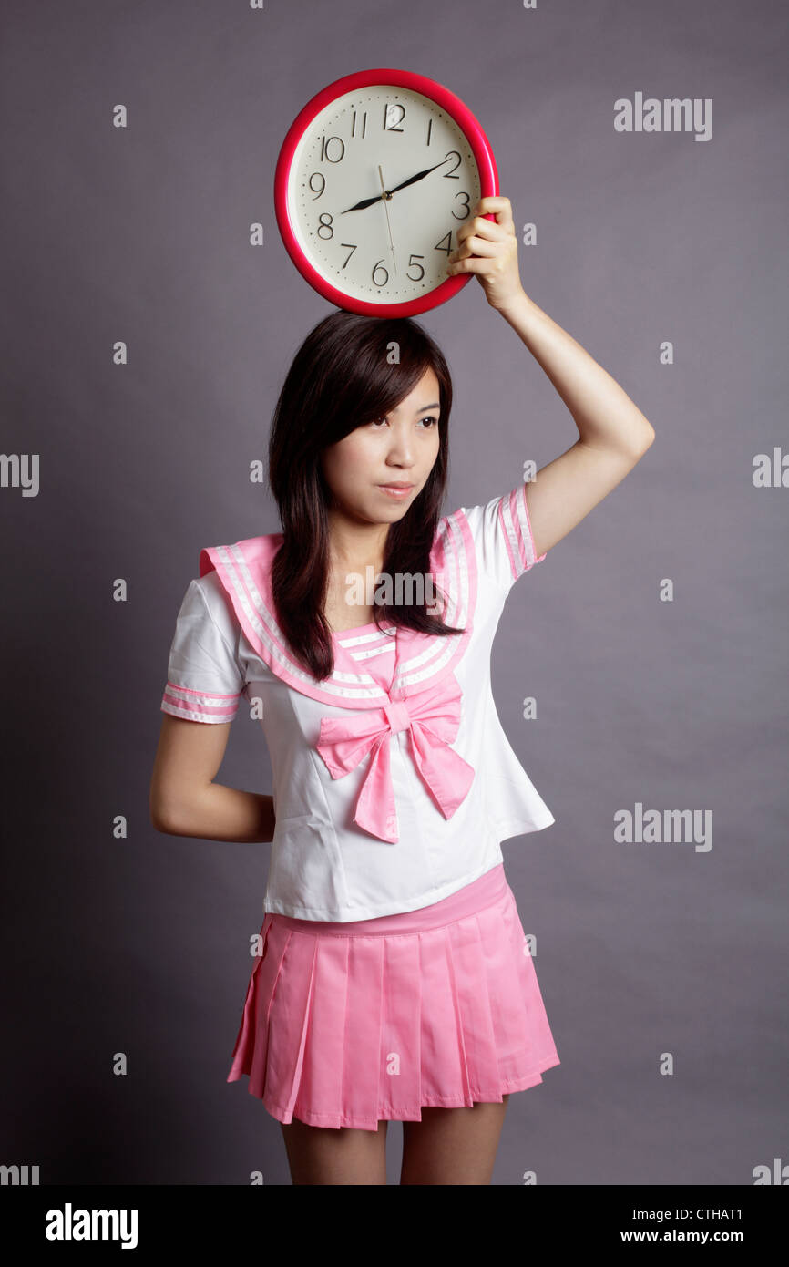 School girl plays clock Stock Photo - Alamy