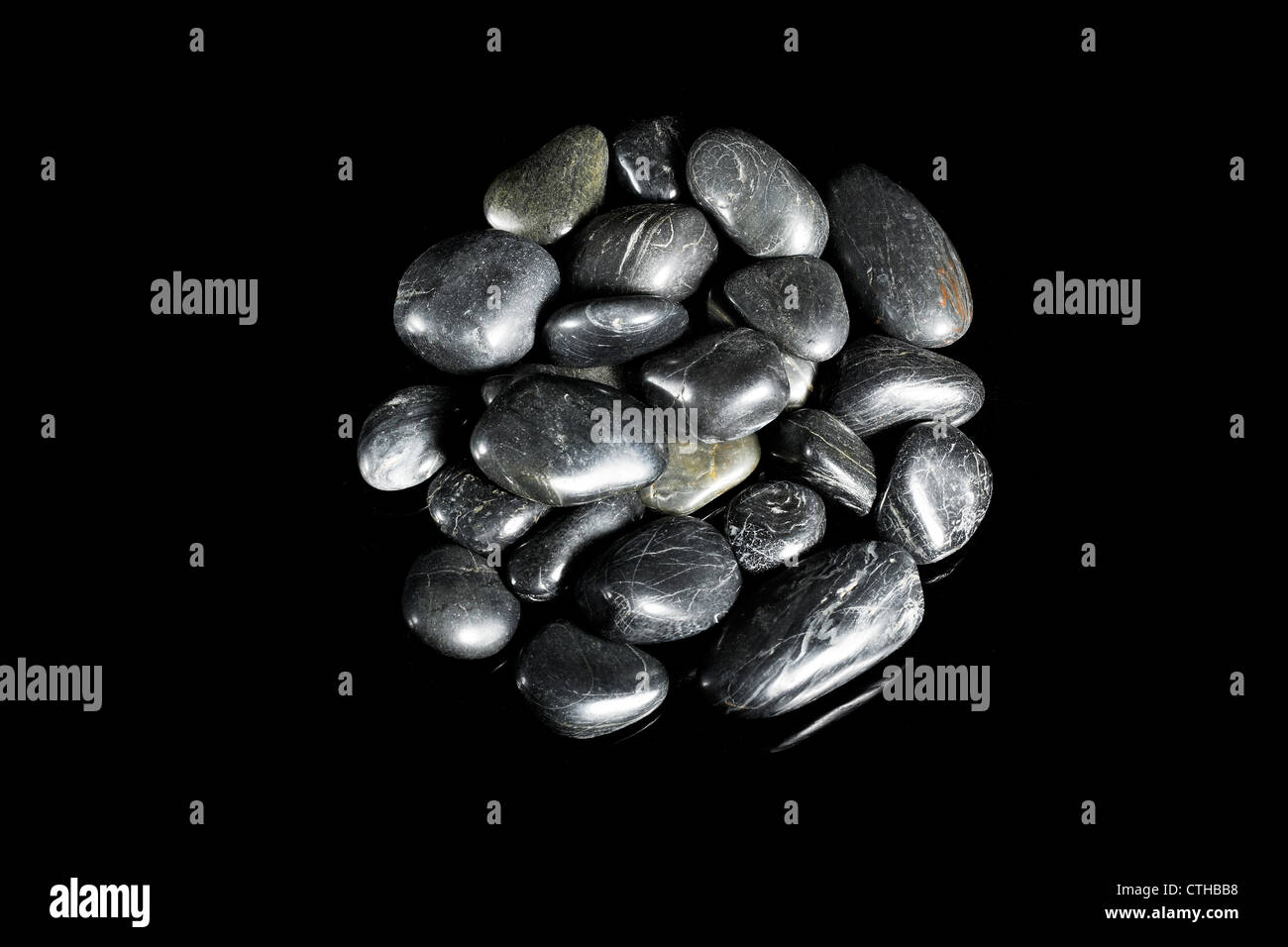 river rocks on black background in a circle Stock Photo - Alamy