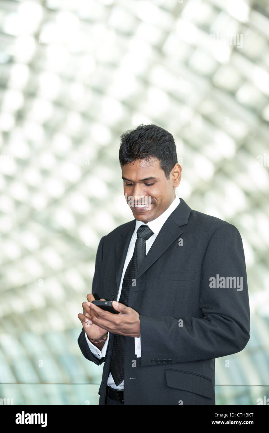 Indian business man using mobile phone Stock Photo - Alamy