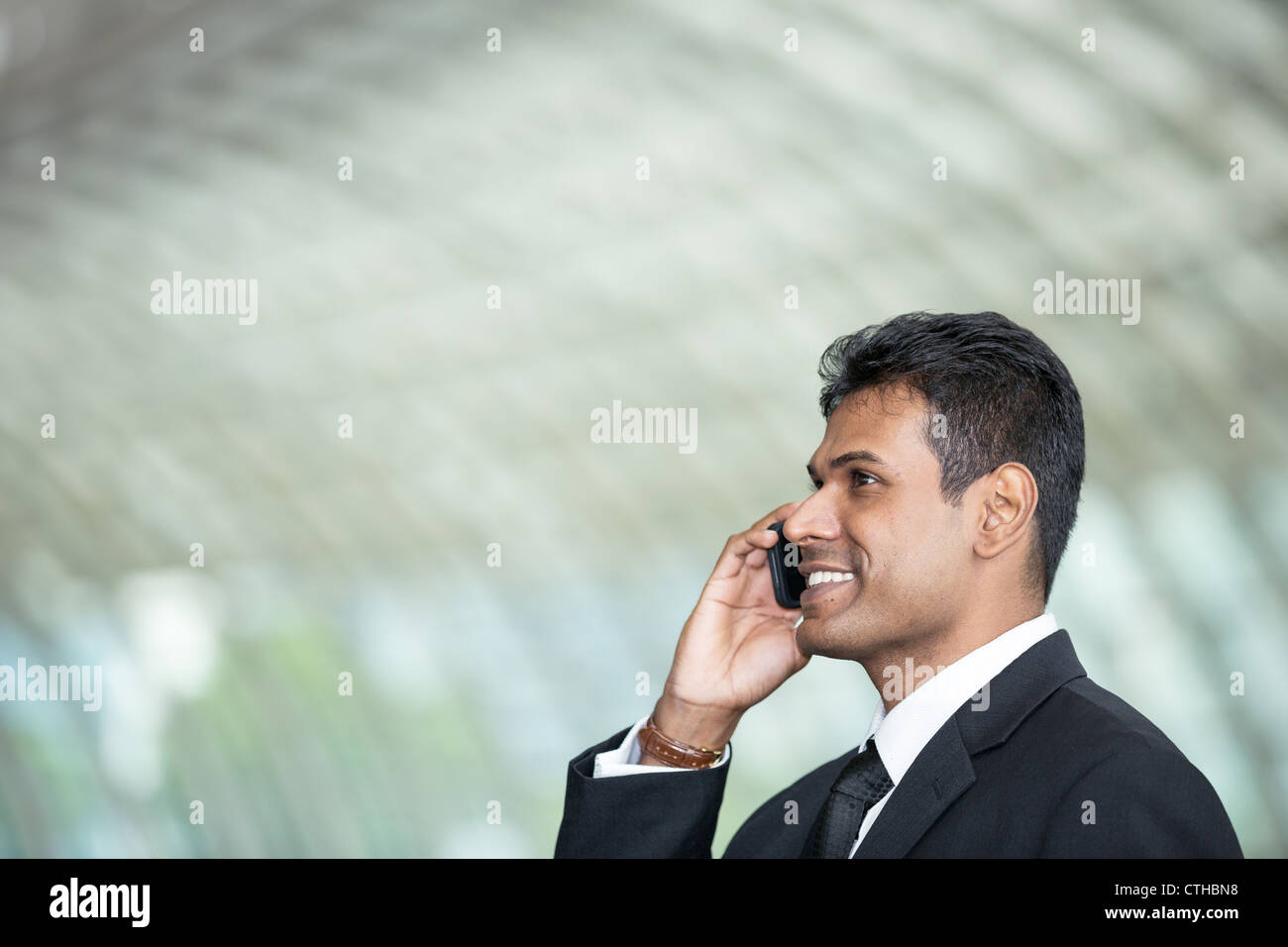 Indian business man using mobile phone Stock Photo - Alamy