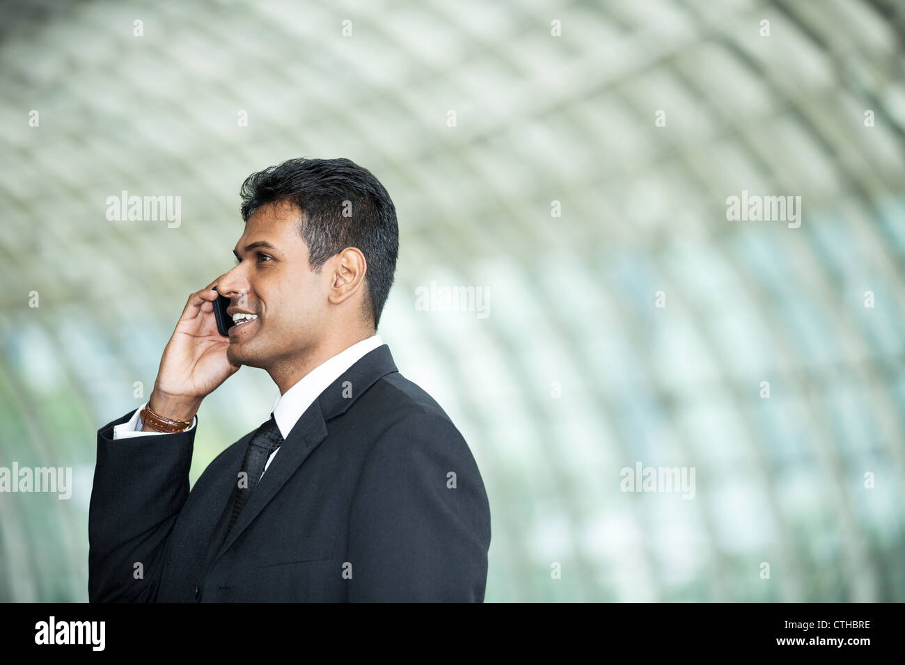 Indian business man using mobile phone Stock Photo - Alamy