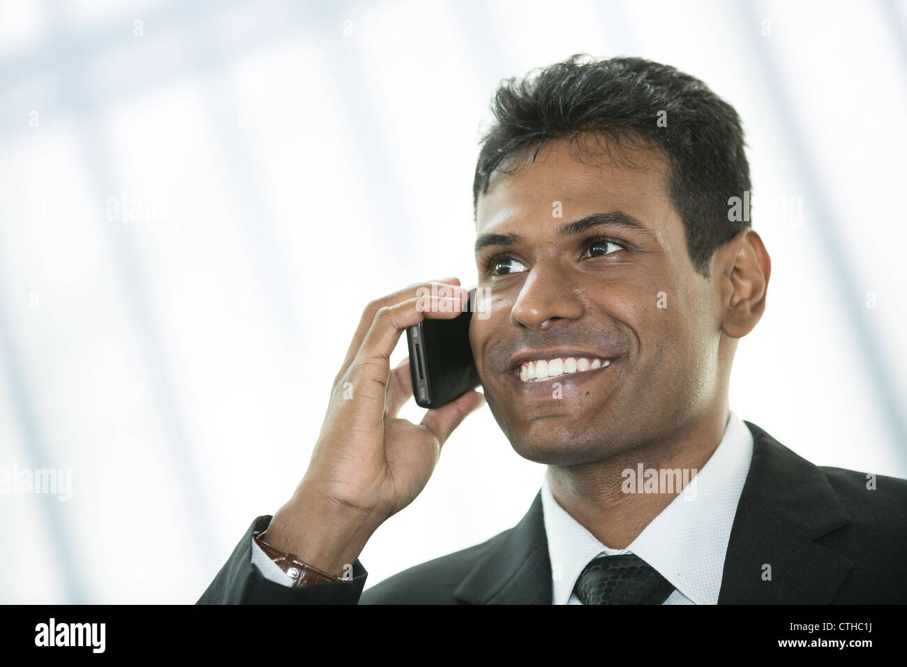 Indian business man using mobile phone Stock Photo - Alamy