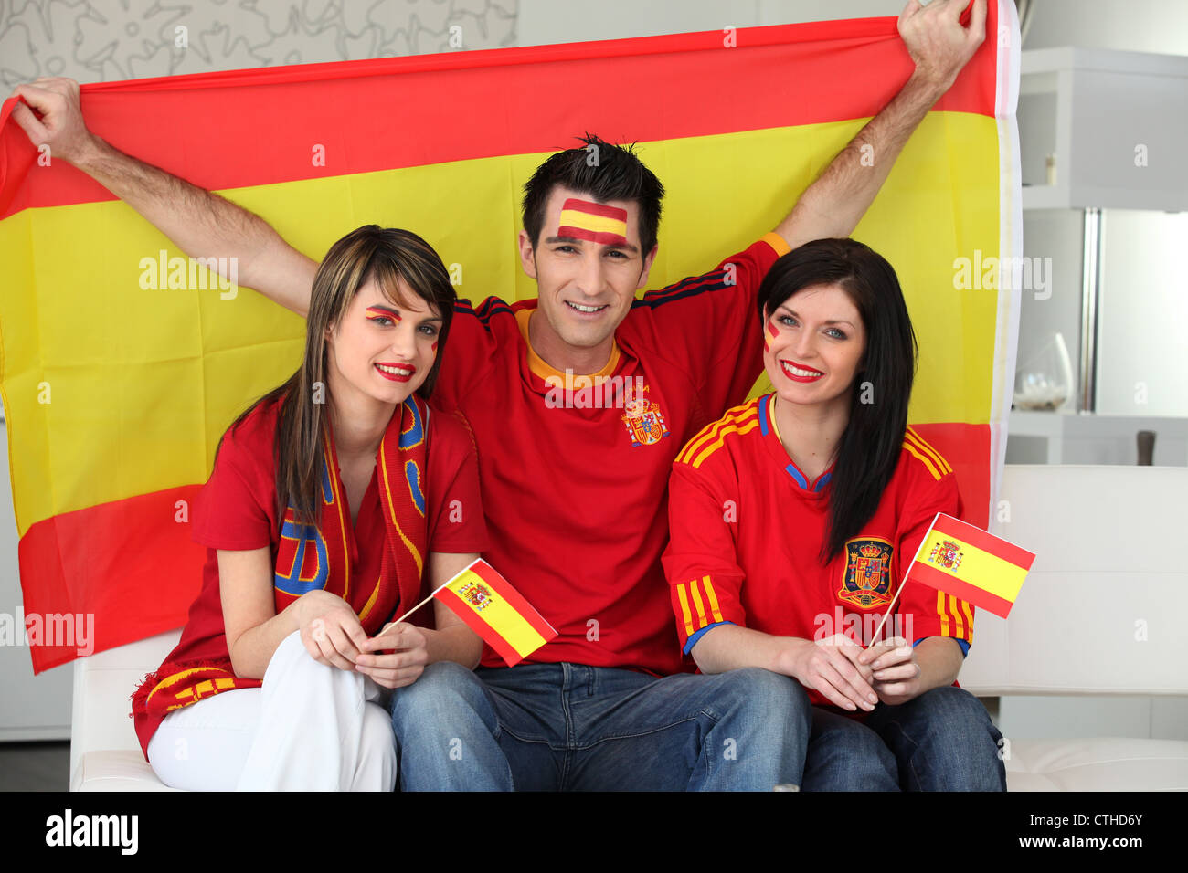 Thee excited Spanish soccer fans Stock Photo - Alamy