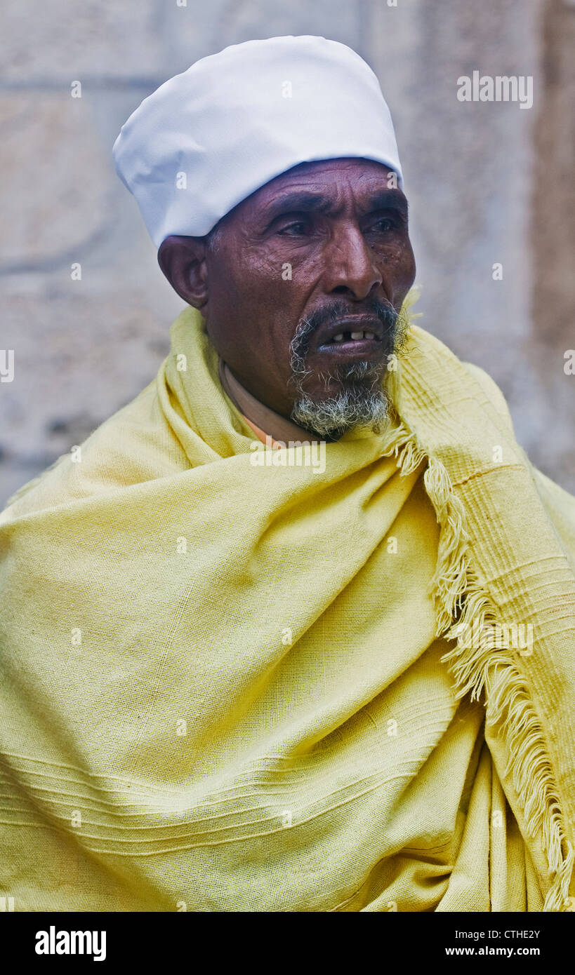 Ethiopian Orthodox priest await the start of the Holy fire ceremony at ...
