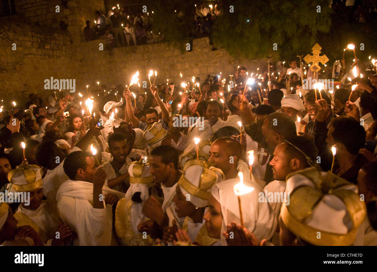Ethiopian Orthodox worshipers hold candles during the Holy fire ...