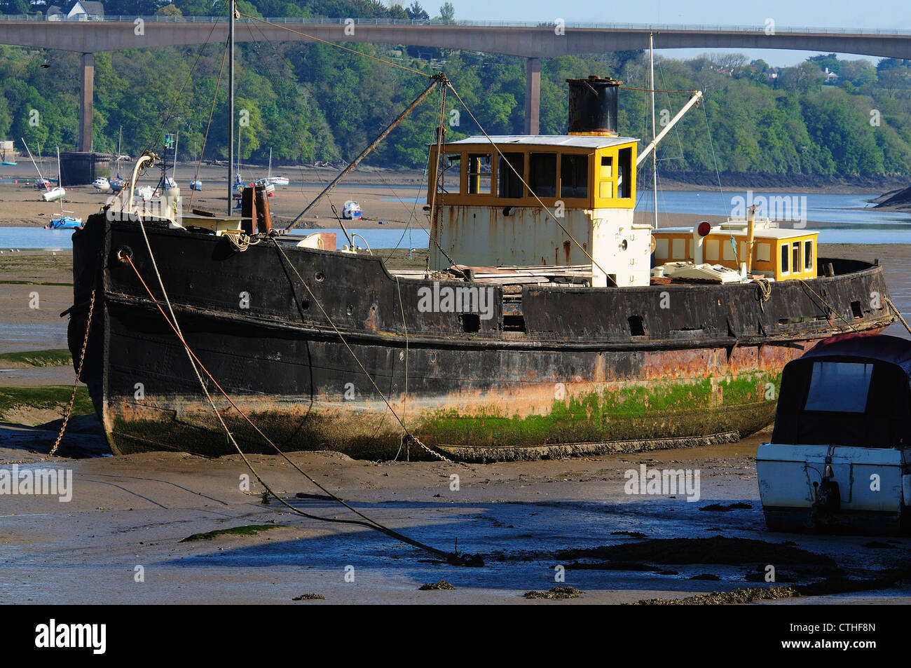 An old boat marooned in the mud at Bideford on the river Torridge UK ...