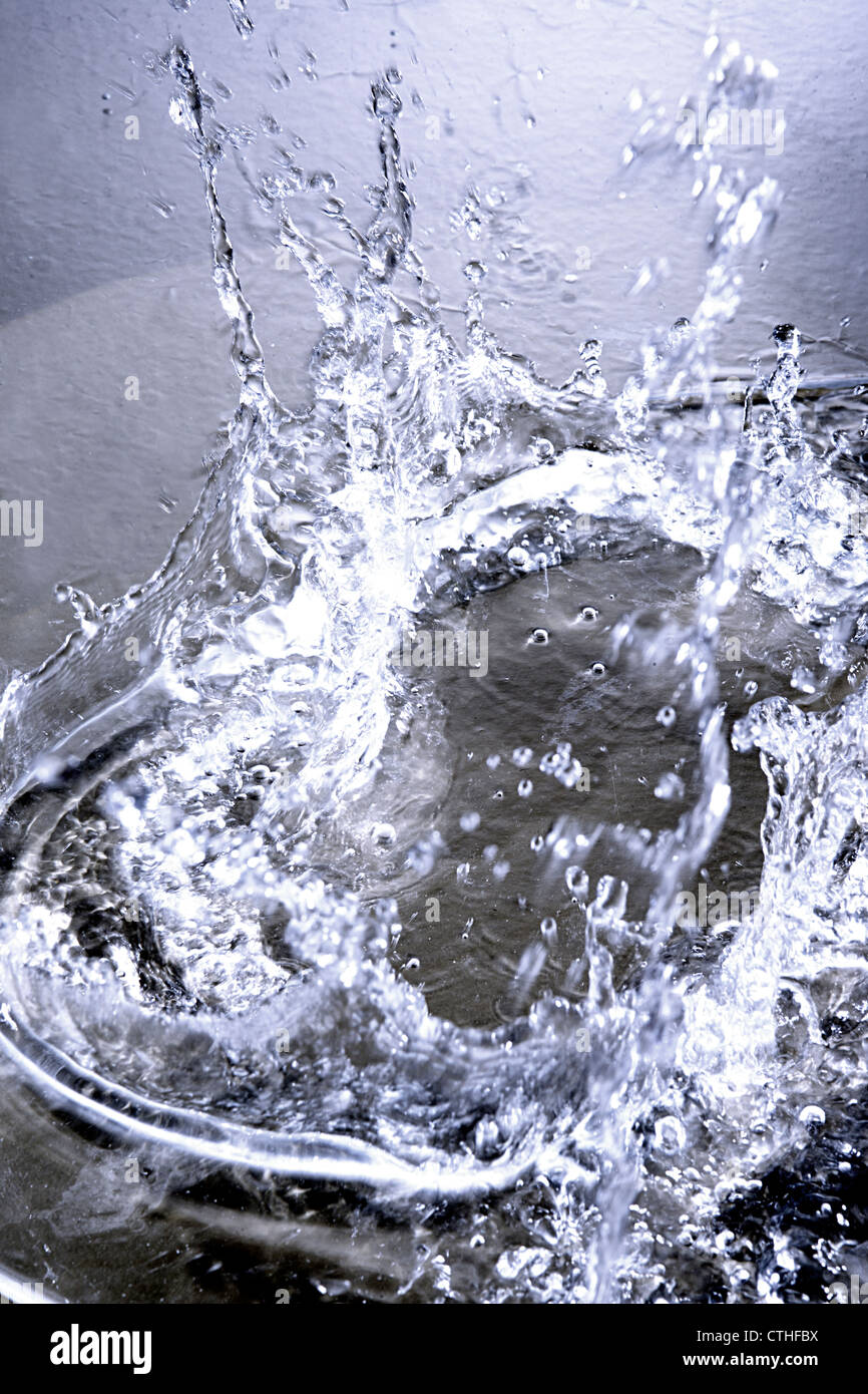 fresh transparent splash water on floor Stock Photo - Alamy
