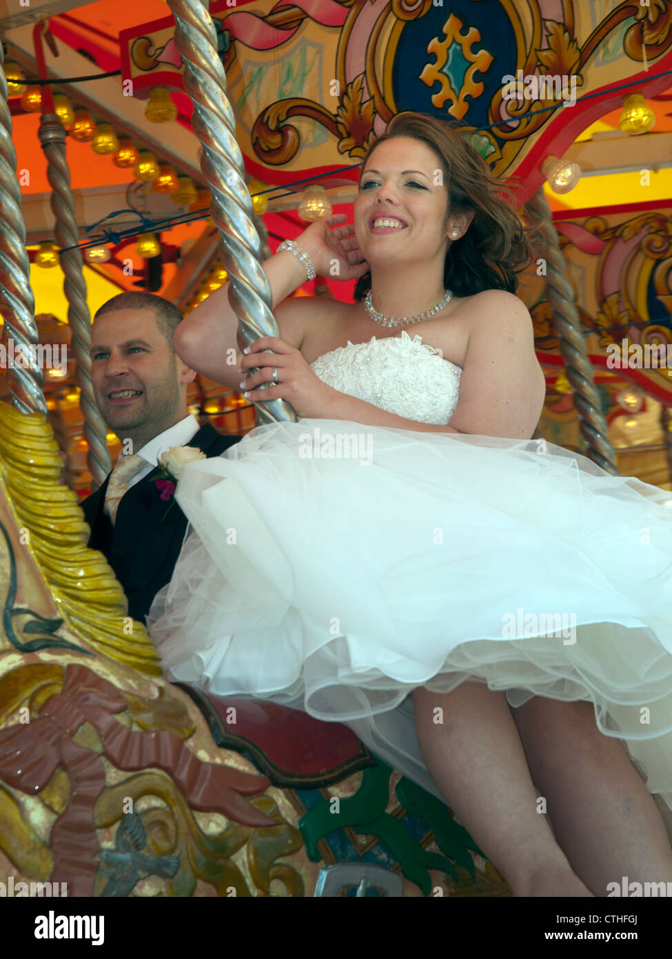 Woman riding carousel horse hi-res stock photography and images - Alamy