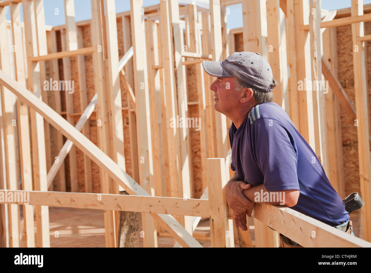 Tradesman Looking At The Framing For New Home Construction; St. Albert ...