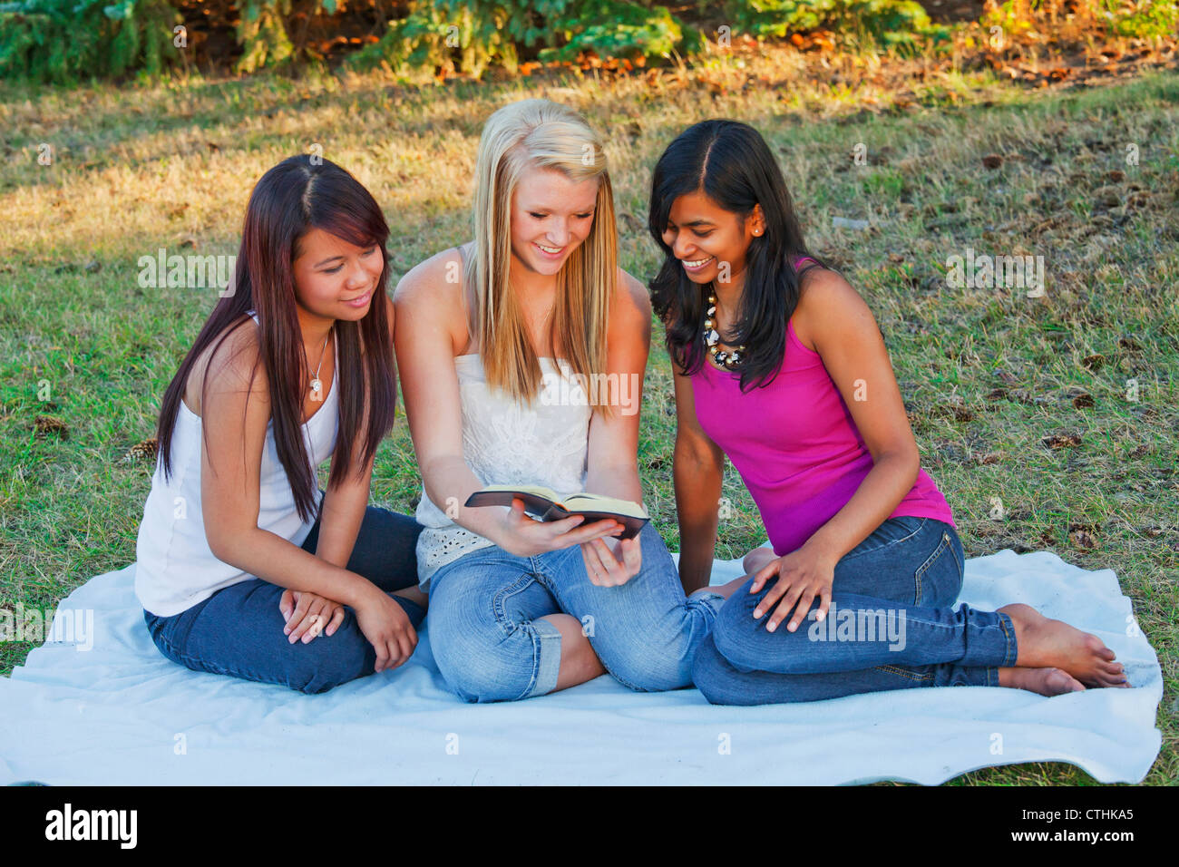 Asian girl reading bible in hi-res stock photography and images - Alamy