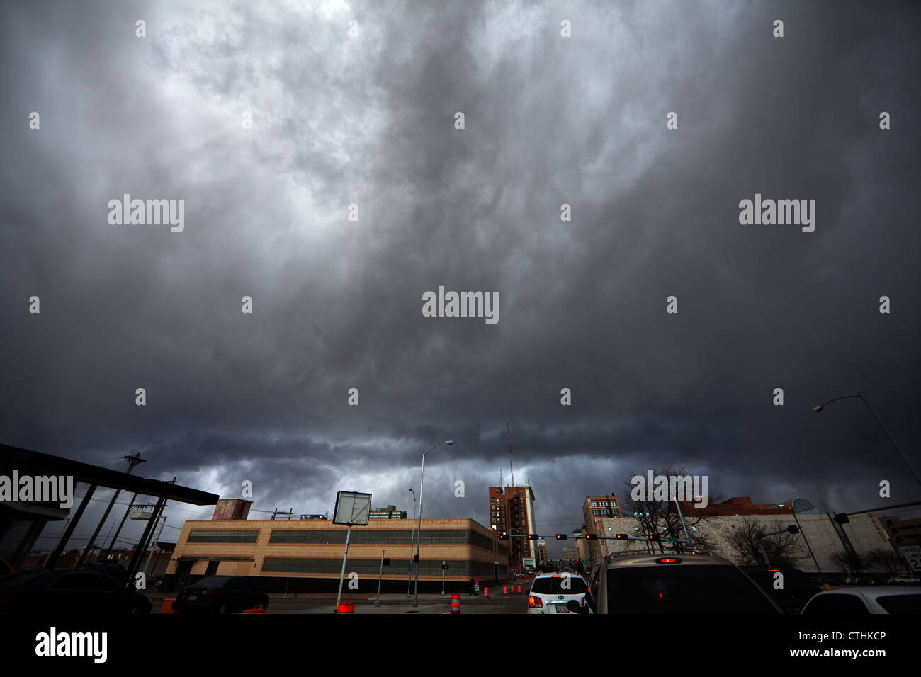 Arcus cloud moving over city street Stock Photo - Alamy
