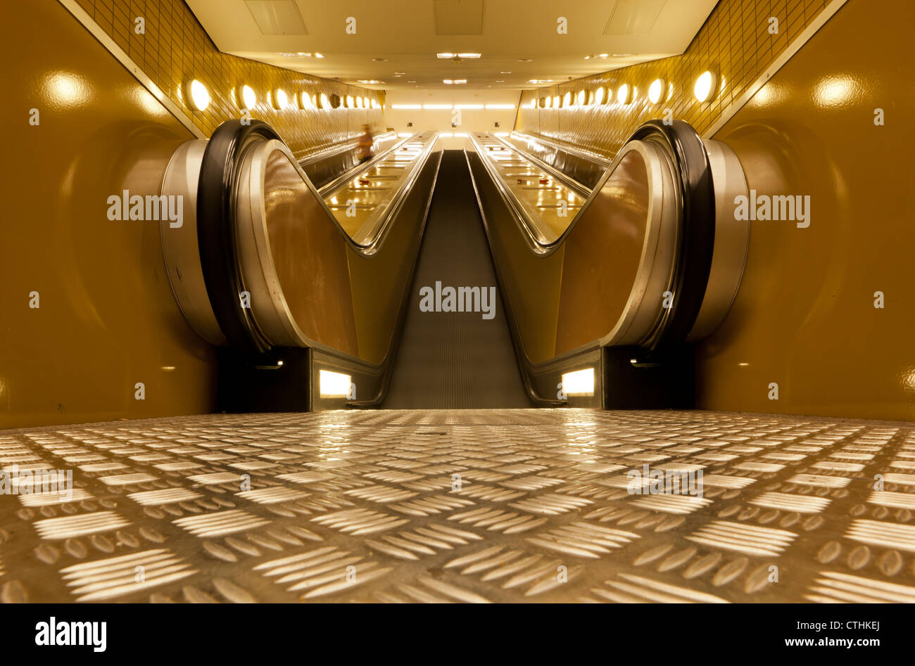 Escalator moving upward, steps are motion blurred Stock Photo - Alamy