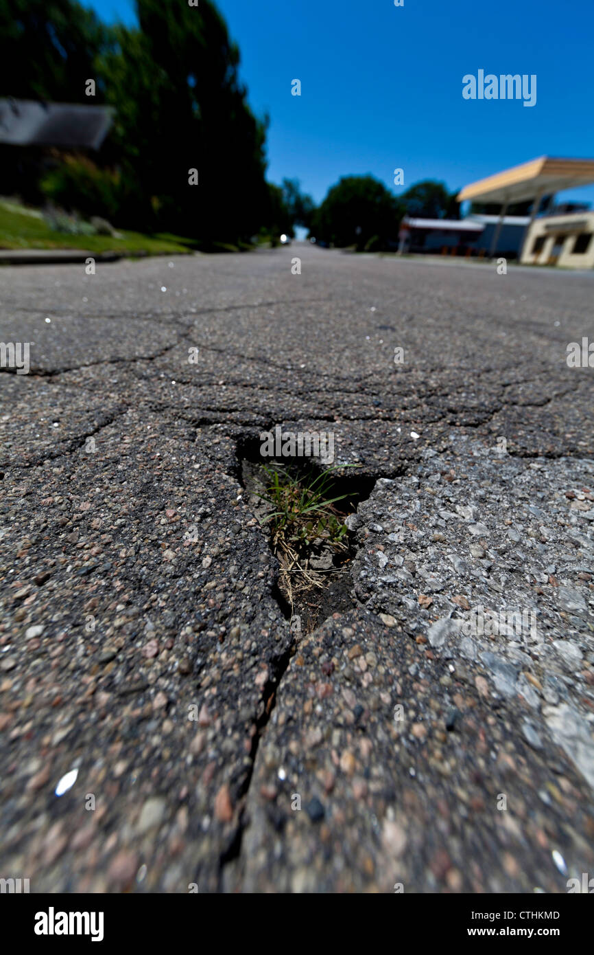 A hole in asphalt road surface Stock Photo - Alamy