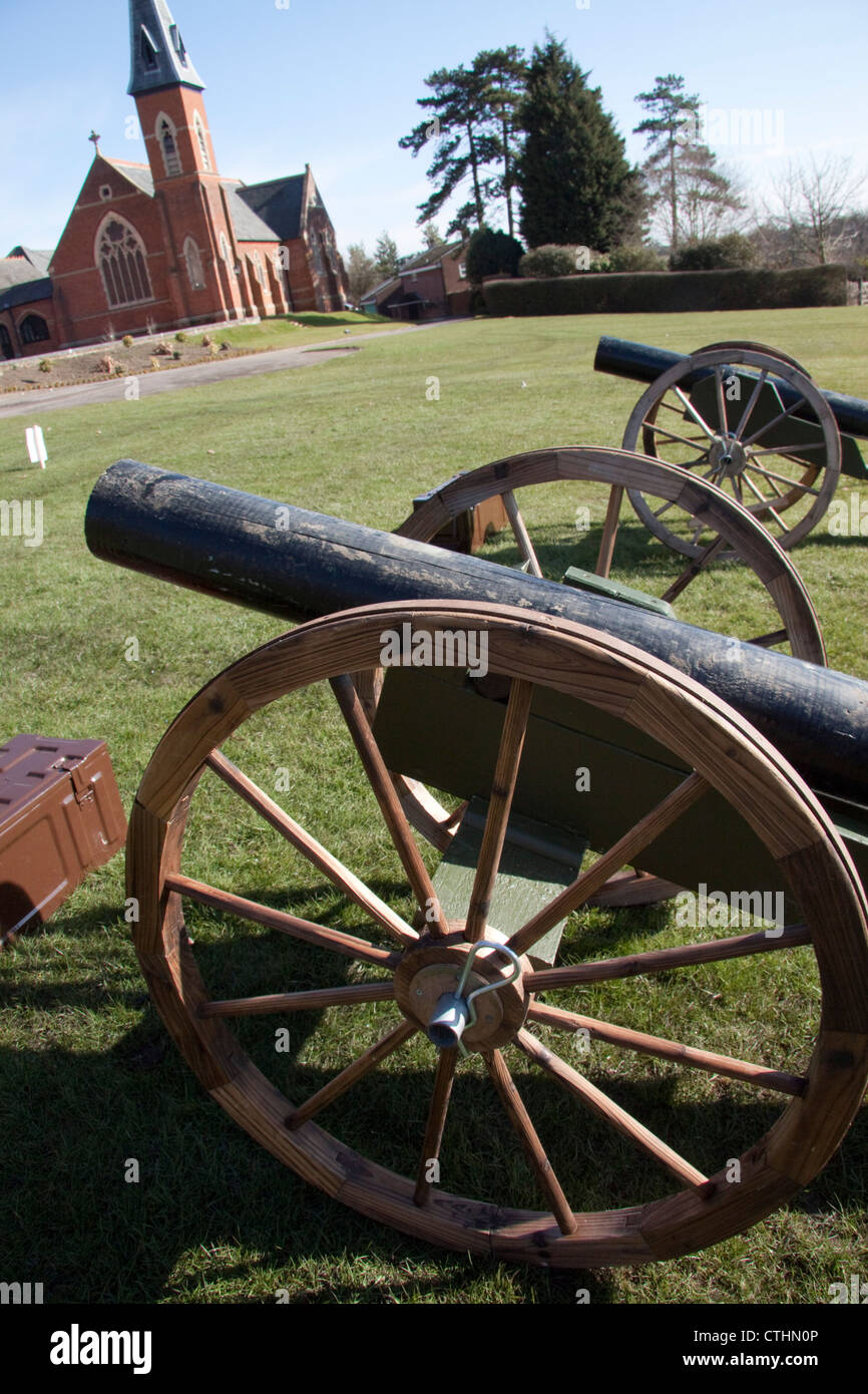 Two reproduction old still cannon standing on a large lawn in front of ...