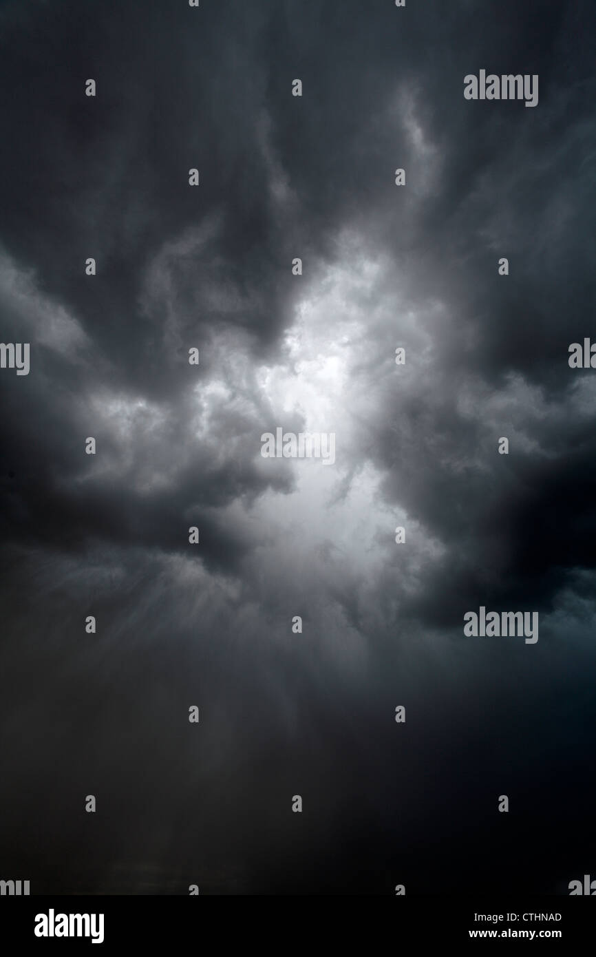 Opening in a thunderstorm cloud system, showing rainfall Stock Photo ...