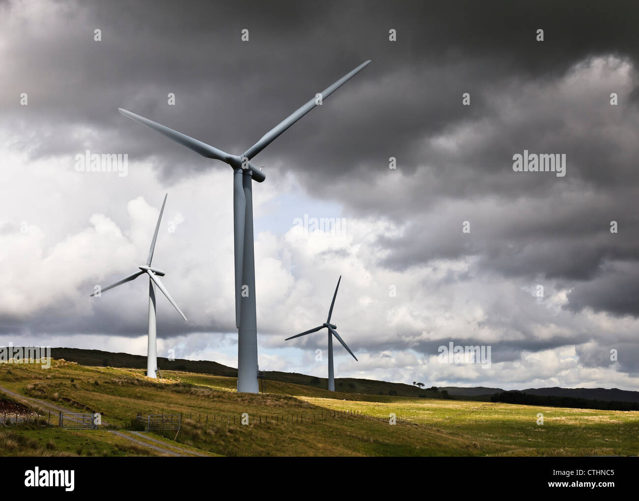 Wind turbines blowing a gray sky away Stock Photo - Alamy