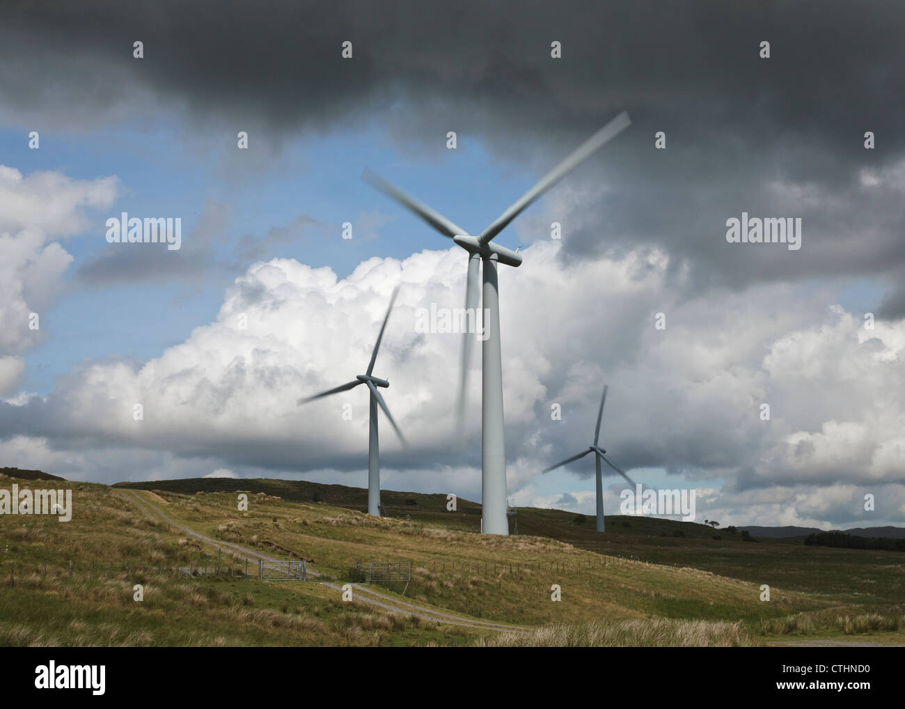 Wind turbines blowing a gray sky away Stock Photo - Alamy