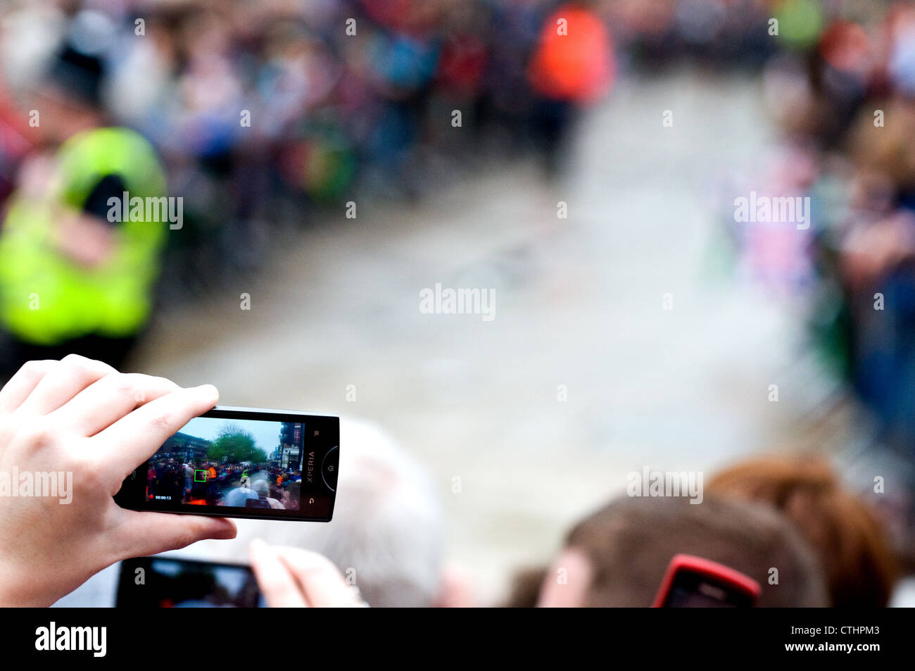 View in a smart phone screen of a parade route Stock Photo - Alamy