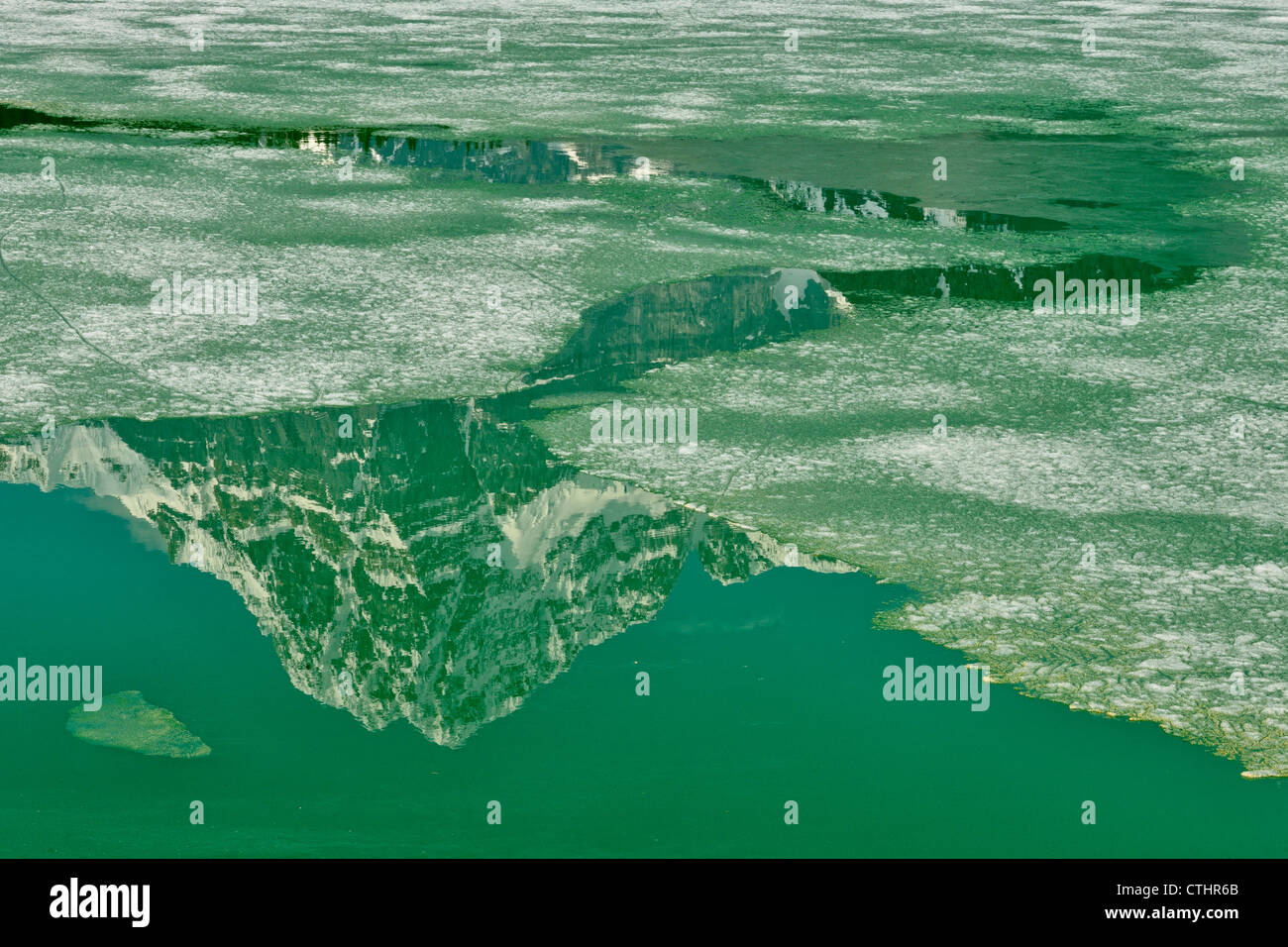 Lower Waterfowl Lake with melting ice and mountain (Mt Chephren ...