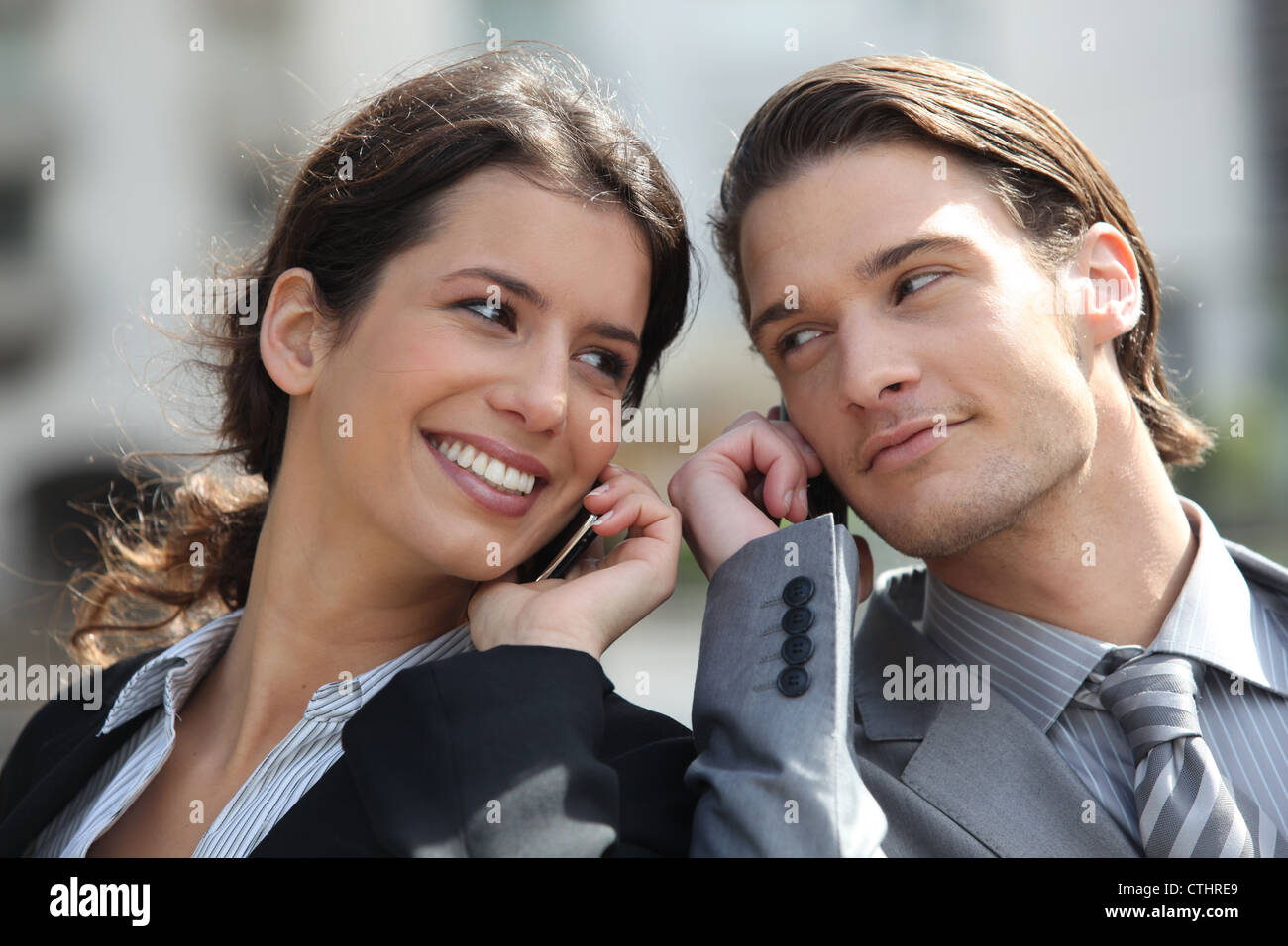 Couple talking on the phone Stock Photo - Alamy
